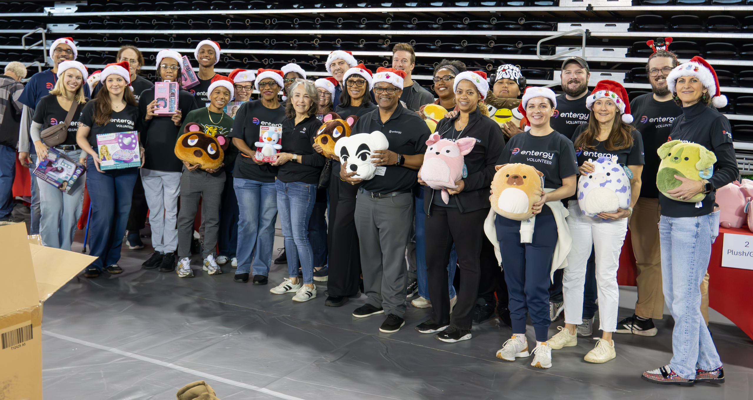 Entergy employees distribute toys, spread holiday joy at The Times ...